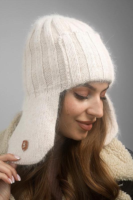 Жіноча молодіжна пухнаста кремова шапка ушанка — ціна 392 грн у каталозі Шапки Купити аксесуари